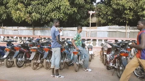 Bamako Mali street with people in front ... | Stock Video | Pond5