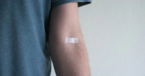 Arm With Bandaid Stock Footage ~ Royalty Free Stock Videos | Pond5