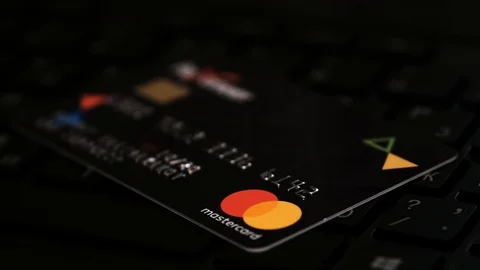 Bank card Visa.. Lights from screen fall... | Stock Video | Pond5