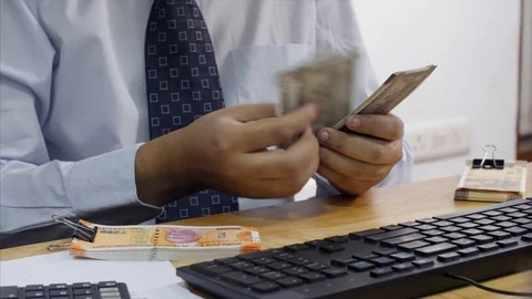Bank cashier counting Rupee 500 Indian c... | Stock Video | Pond5