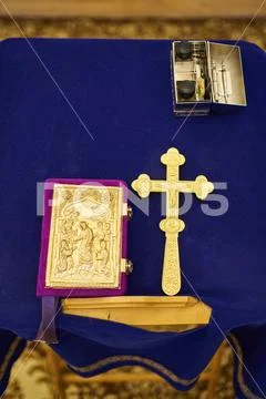 Photograph: A baptismal box for a priest, a golden cross and an ...