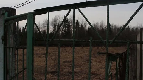 barbed wire fence gate prison exterior o... | Stock Video | Pond5