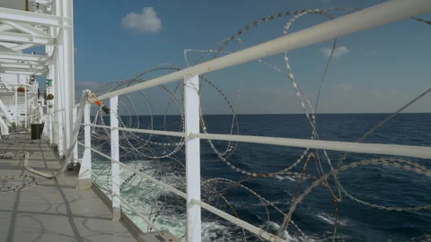 Barbed wire is fixed on railing of vesse... | Stock Video | Pond5