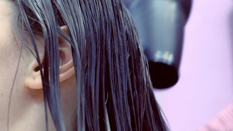 Barber drying hair with hair dryer. Hair... | Stock Video | Pond5