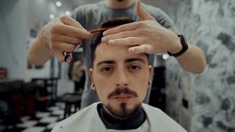 Barber Giving A Haircut To A Young Man I... | Stock Video | Pond5