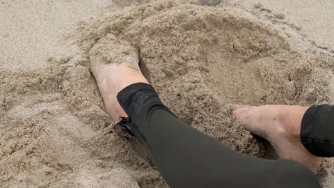 bare feet digging and playing in sand | Stock Video | Pond5