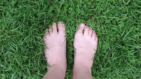 Bare feet on green grass. Selfie. Female... | Stock Video | Pond5
