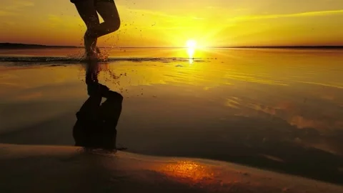 bare feet jumping and running on the sea... | Stock Video | Pond5