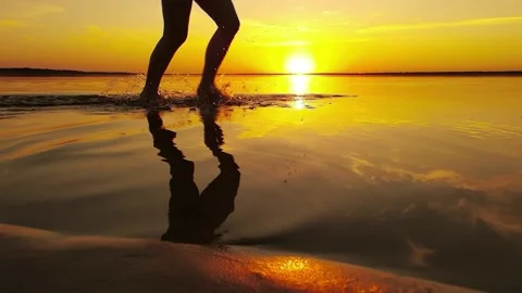 bare feet jumping and running on the sea... | Stock Video | Pond5