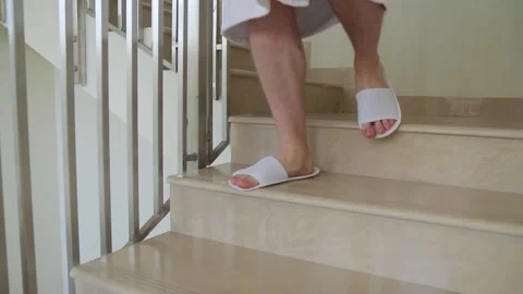 bare feets in white slippers descend the... | Stock Video | Pond5