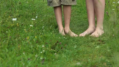 Barefoot people walking together in summ... | Stock Video | Pond5