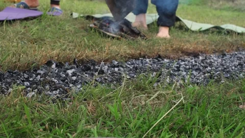 Barefoot person coal walking or fire wal... | Stock Video | Pond5