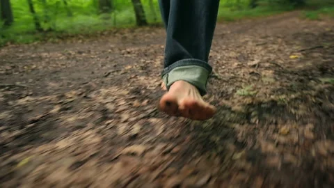 Barefoot walk on forest ground | Stock Video | Pond5