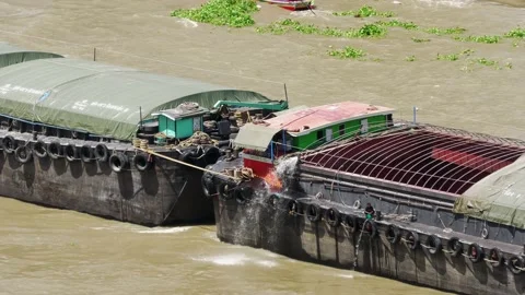 Barge pumping water into Chao Phraya Riv... | Stock Video | Pond5