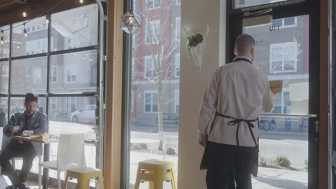 Barista Flipping The Closed Sign In The ... | Stock Video | Pond5