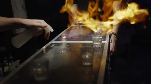 bartenders do shows with fire and alcoho... | Stock Video | Pond5