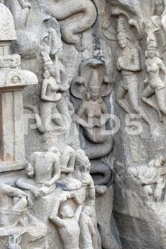 Photograph: Bas relief Naga river snake gods on the rock cut wall of ...