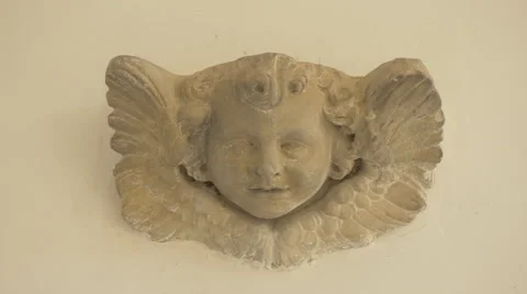 Bas relief representing a baby's face at... | Stock Video | Pond5