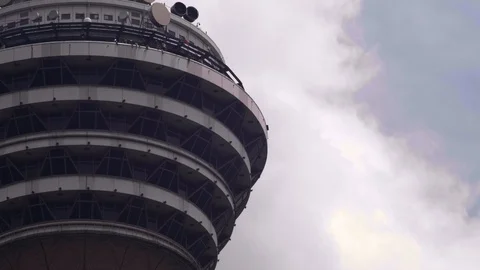 Base jumpers jumping from Menara tower i... | Stock Video | Pond5