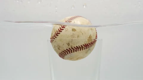 Baseball falling into water isolated on ... | Stock Video | Pond5