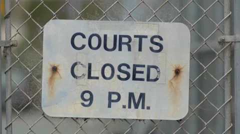 Basketball court hours sign on chain lin... | Stock Video | Pond5