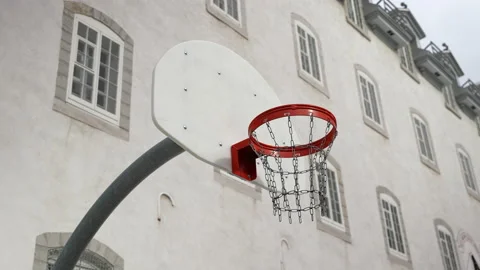 Basketball Hoop With A Large Building On... | Stock Video | Pond5