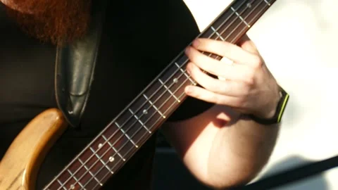 Bass guitar with wood texture. The guita... | Stock Video | Pond5