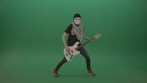 Bass man in white mask play guitar on gr... | Stock Video | Pond5