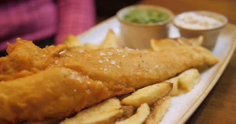 Battered cod and chips in chip shop, Eng... | Stock Video | Pond5