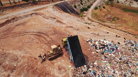 Beach landfill. Trucks working on sandy ... | Stock Video | Pond5