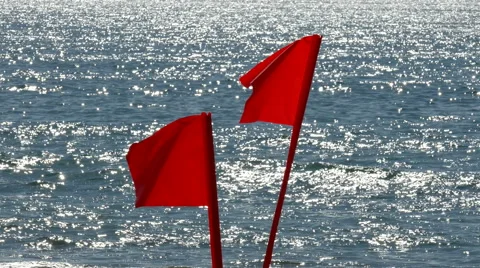 Beach lifeguard warning flags with Pacif... | Stock Video | Pond5