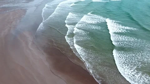 A beach with sand and tidal waves. White... | Stock Video | Pond5