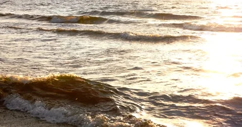 Beach scene with sun beams in the horizo... | Stock Video | Pond5
