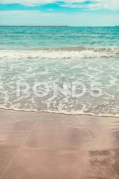 Beach sea water flow with blue sky. Seascape wallpaper. ~ Hi Res #131211458