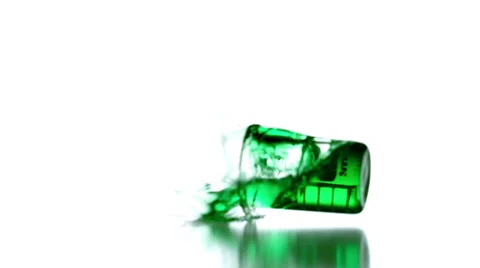 Beaker falling and spilling green liquid | Stock Video | Pond5