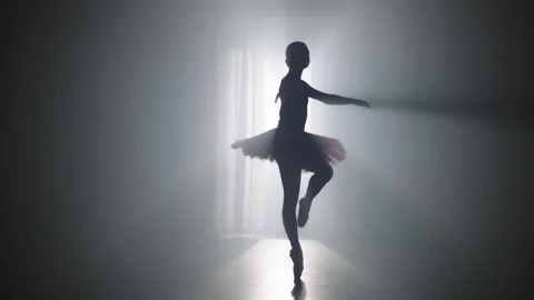 In the beam of the spotlight, the baller... | Stock Video | Pond5