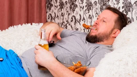 bearded Fat man with a big belly lies on... | Stock Video | Pond5