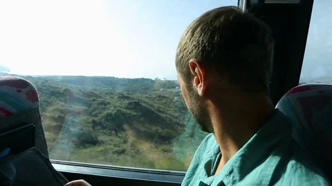 Bearded man sitting on coach and watchin... | Stock Video | Pond5