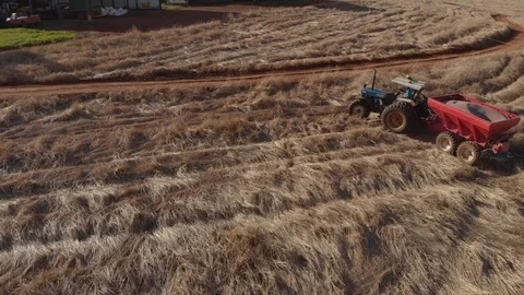 Beautiful Aerial Shot of Tractor in a Fi... | Stock Video | Pond5