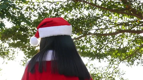 Beautiful asian girl wearing Santa Claus... | Stock Video | Pond5
