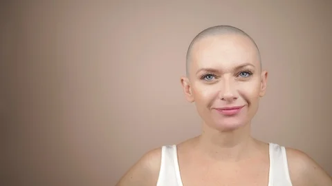 beautiful bald woman dancing on a beige ... | Stock Video | Pond5