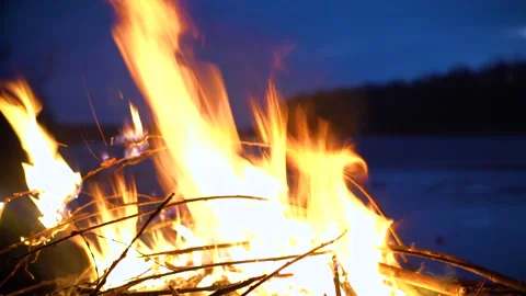 Beautiful Bonefire on the Bank of the Ri... | Stock Video | Pond5