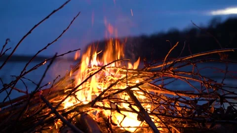 Beautiful Bonefire on the Bank of the Ri... | Stock Video | Pond5