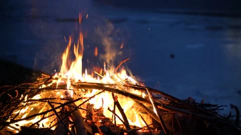 Beautiful Bonefire on the Bank of the Ri... | Stock Video | Pond5