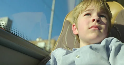 Beautiful Boy Look Out Of Window Watch a... | Stock Video | Pond5