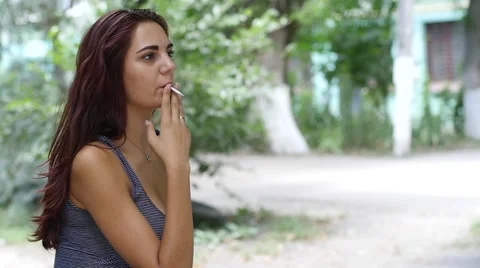 Busty Smoking Girl Stock Footage ~ Royalty Free Stock Videos | Pond5