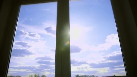 beautiful clouds through the window, sun... | Stock Video | Pond5