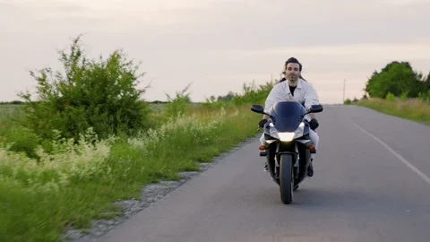 Beautiful couple rides sport motorcycle ... | Stock Video | Pond5