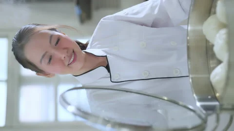 Beautiful female chef cooking at kitchen... | Stock Video | Pond5