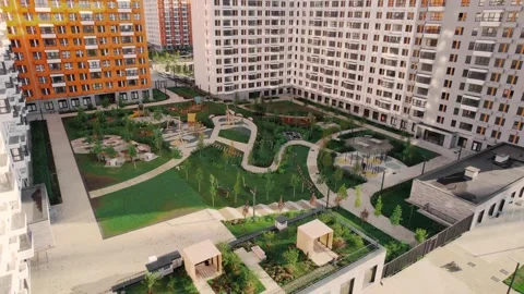 Beautiful fenced yard of a tall high-ris... | Stock Video | Pond5